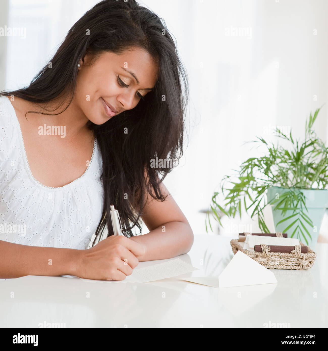Woman drying pan Stock Photo - Alamy