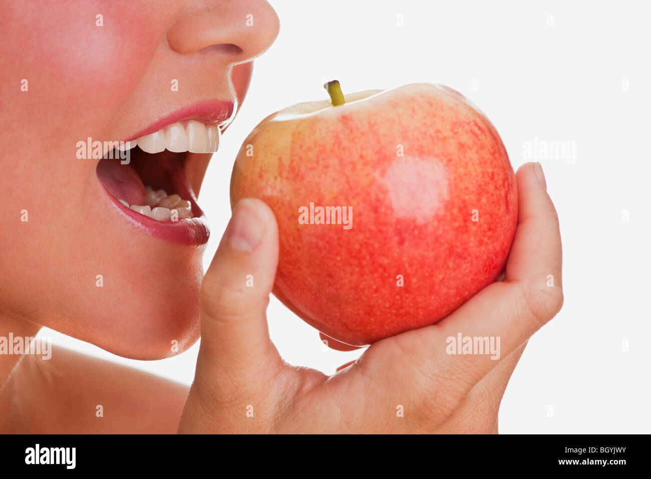 Woman eating apple Stock Photo - Alamy