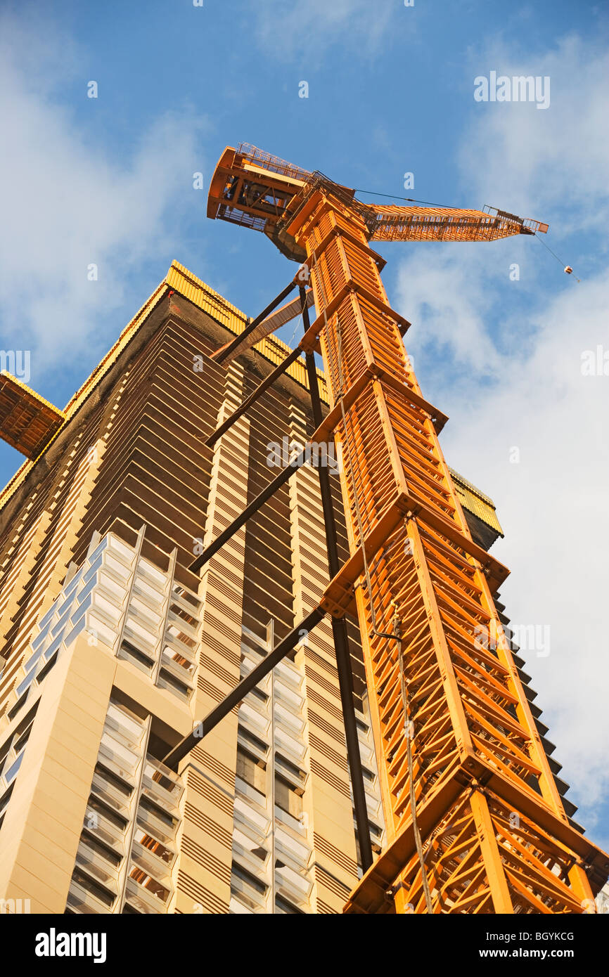 Crane and high-rise building Stock Photo - Alamy