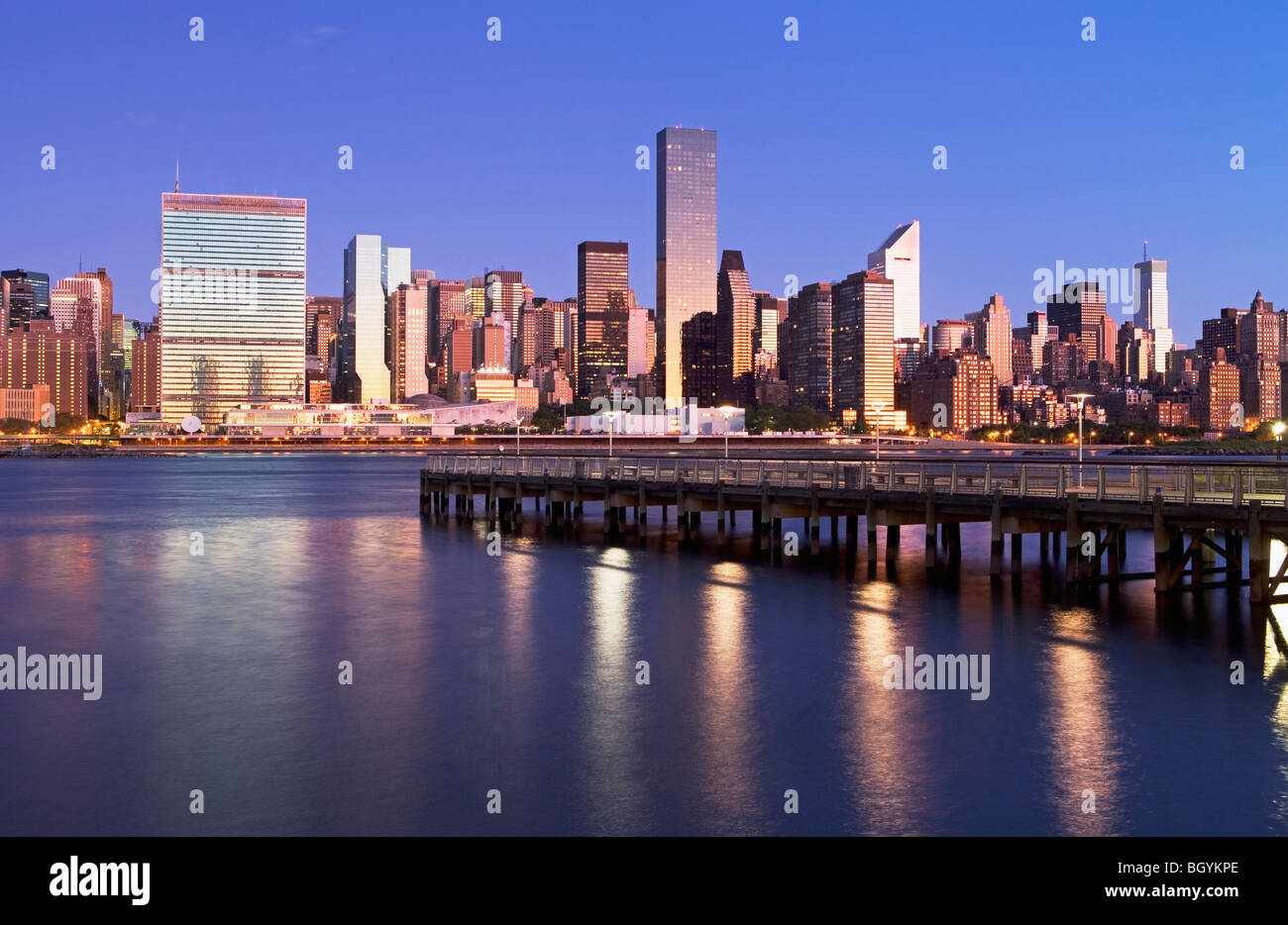 Waterfront cityscape at night Stock Photo - Alamy