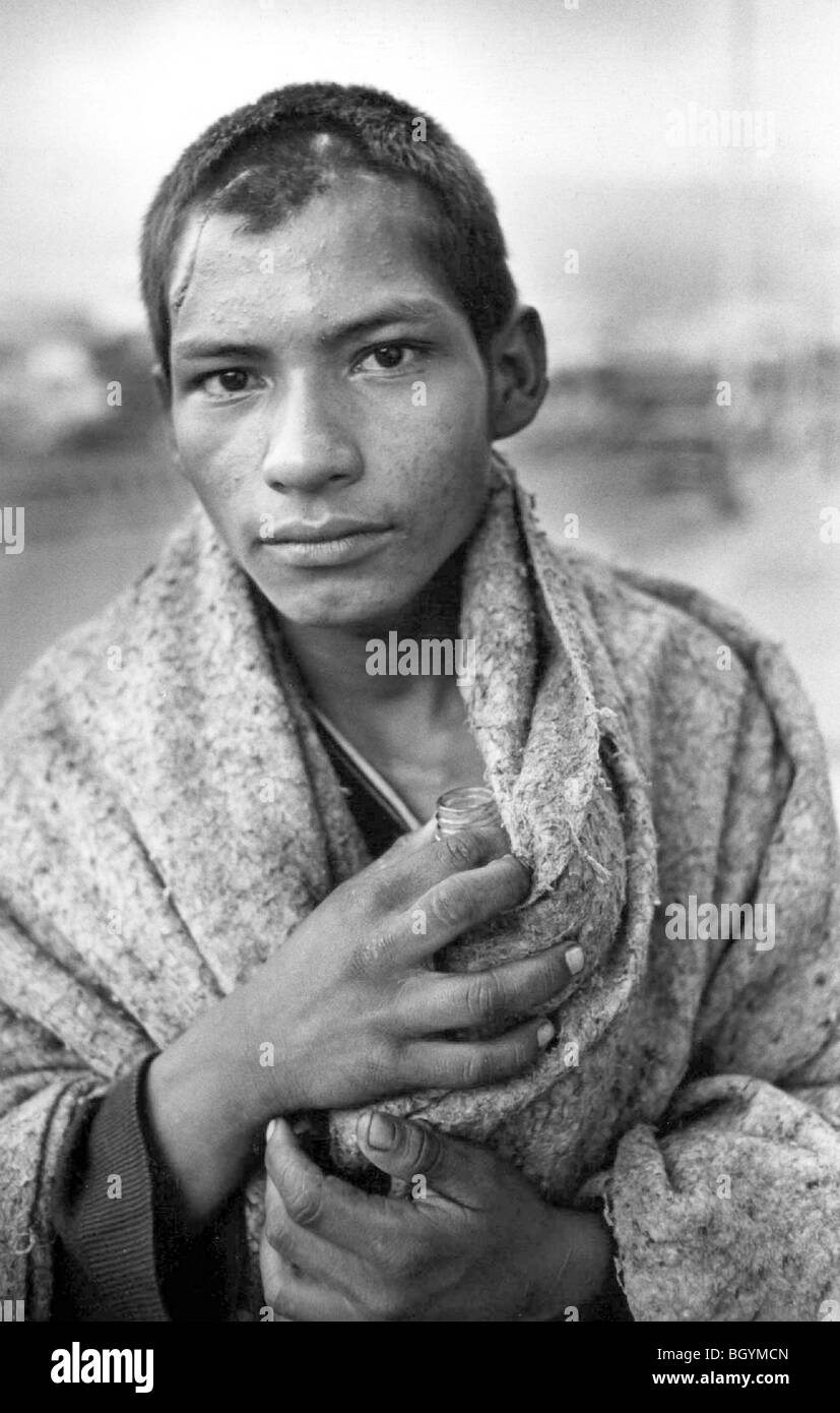 COLOMBIA. HOMELESS CHILD WITH A BOTTLE OF SNIFFING GLUE IN THE STREETS ...