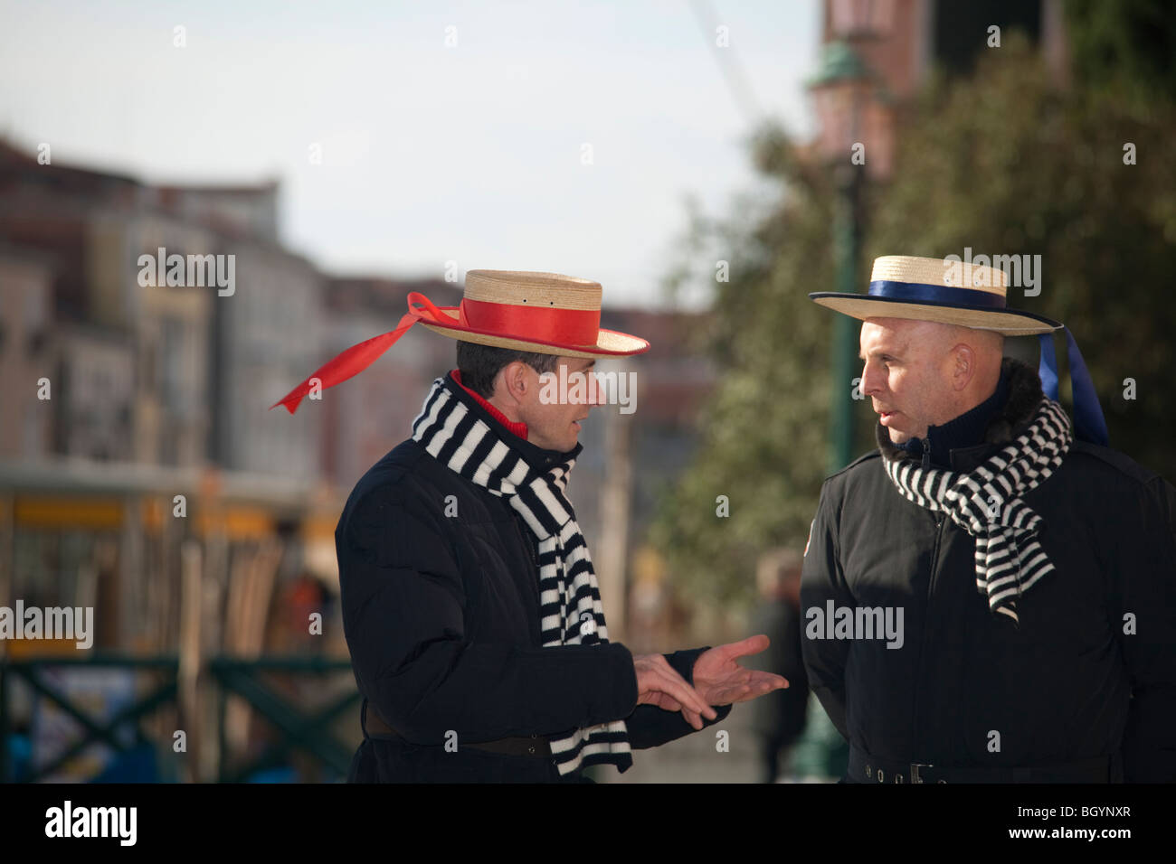 GONDOLIERS TALKING TO EACH-OTHER IN VENICE WEARING TRADITIONAL SAILORS ...