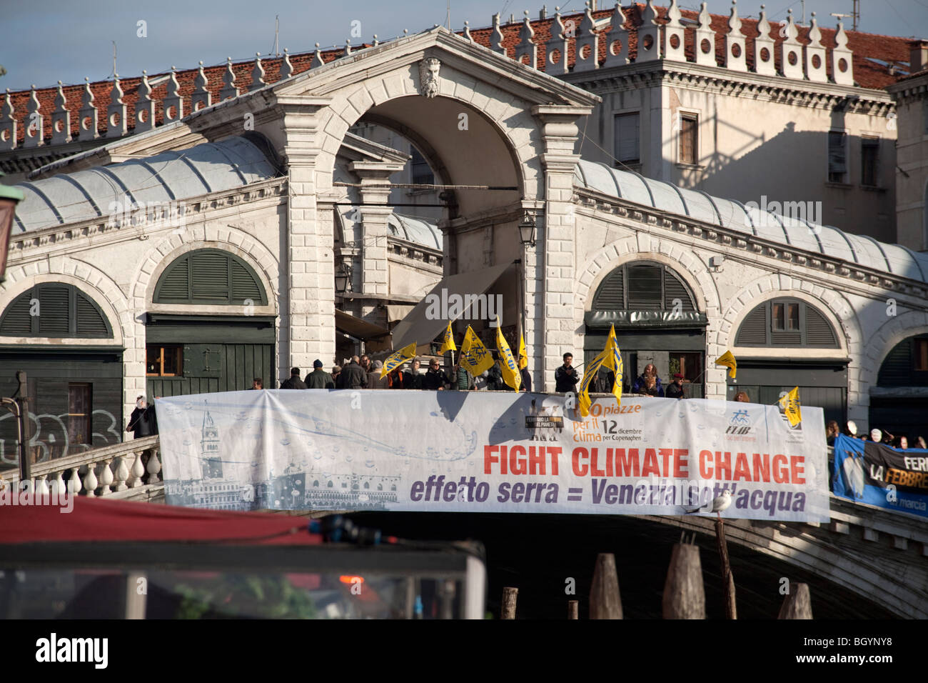 Fight climate change in Venice. Demonstrators with yellow flags ...