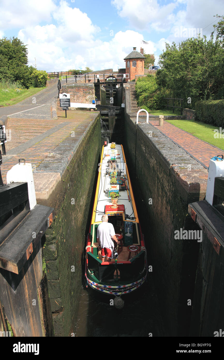 Narrowboat entering the first of the three Bratch Locks, Staffordshire ...