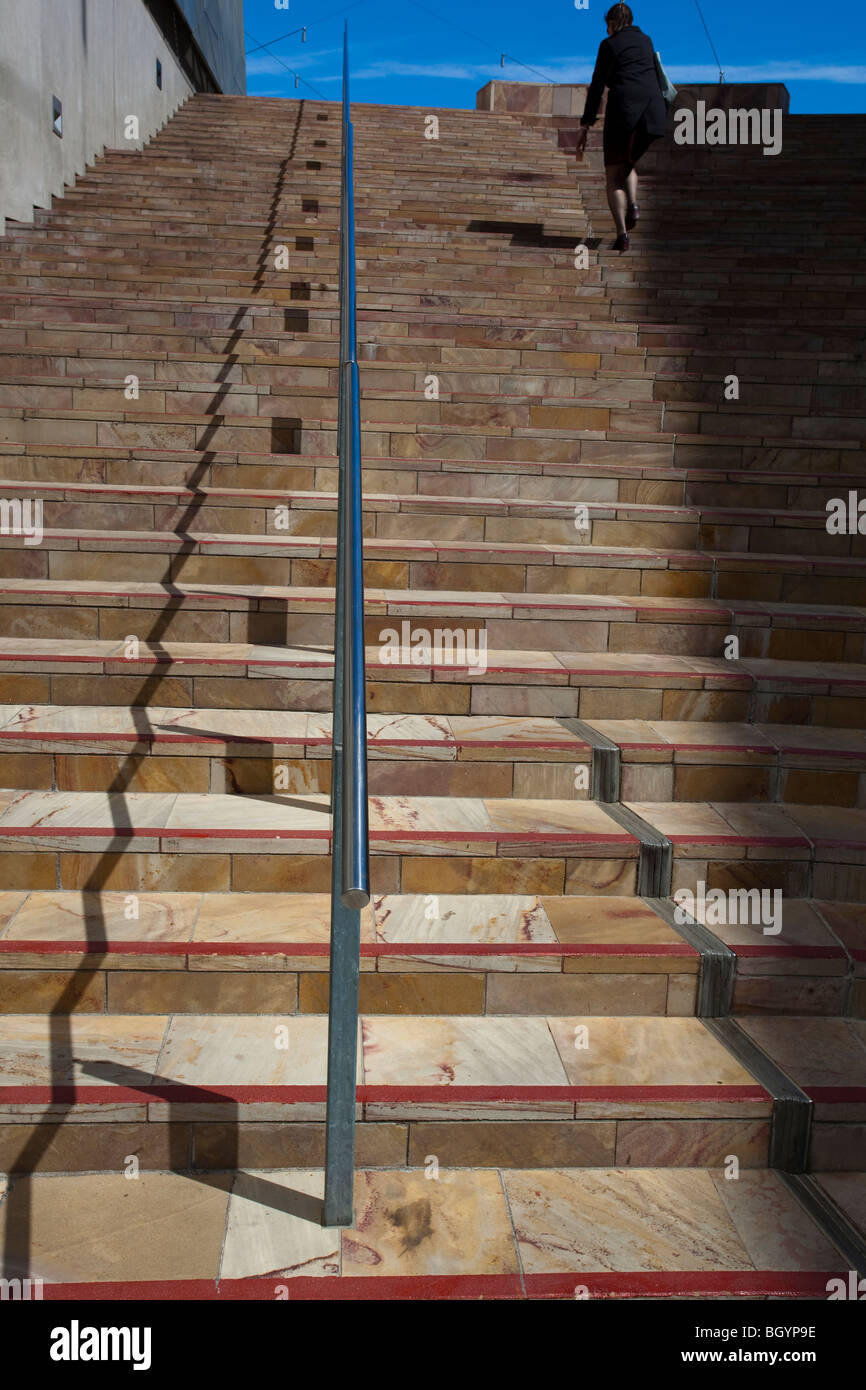Pedestrian on Kimberely Sandstone steps Federation Square, Melbourne ...