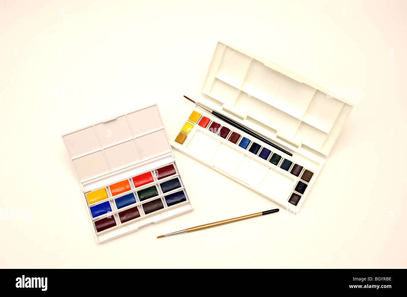 Two boxes of half and full pan watercolour paints Stock Photo - Alamy