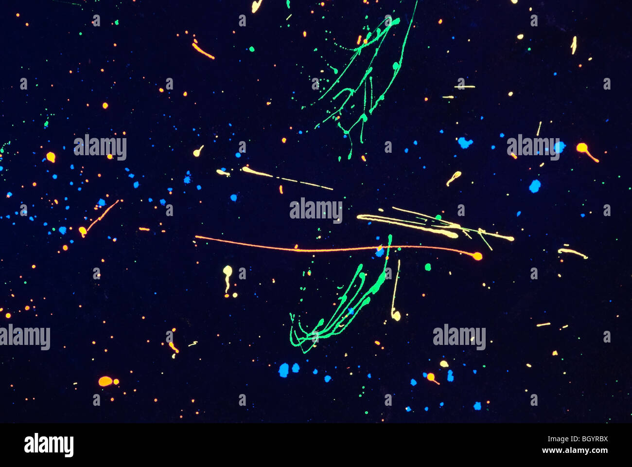 Stock photo of random splatters in neon day glo paint under blacklight ...