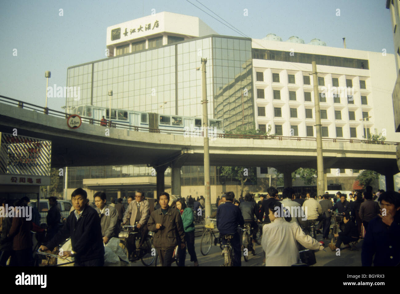 Chinese commuters pass a railway in Beijing during October 1992 Stock ...