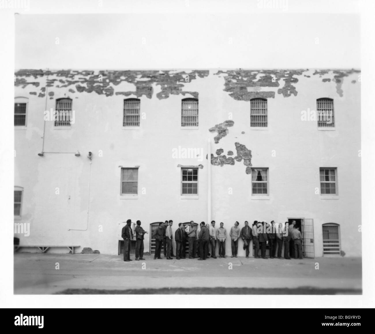 Old reformatory. Inmates standing in line waiting to be let into the ...