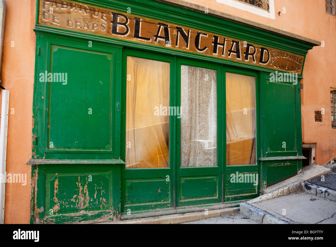 OLD CLOSED SHOP WINDOW WITH GREEN PAINT CHIPPING OFF Stock Photo - Alamy
