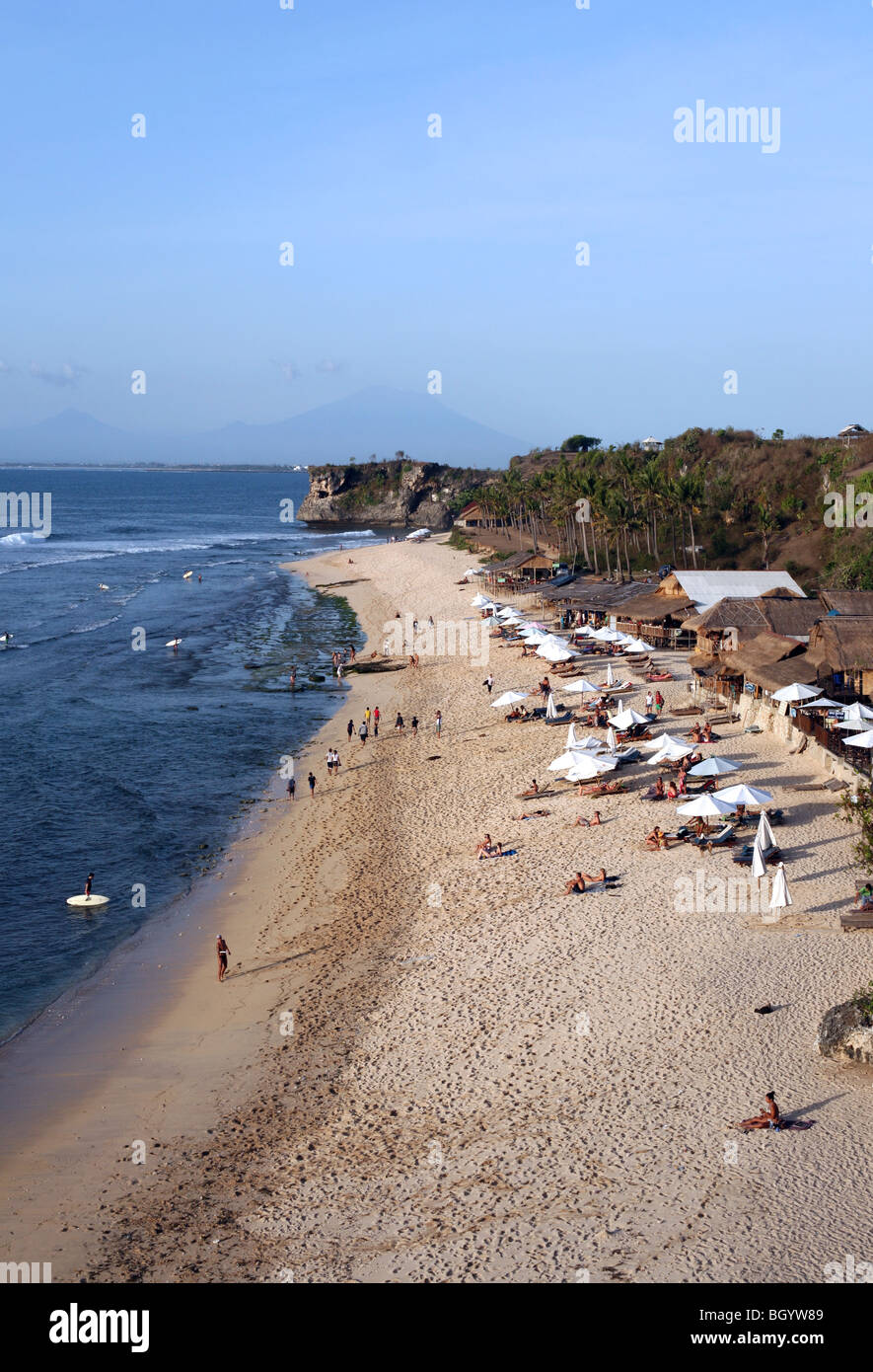 Sunbathers and surfers enjoying the sun and sand. Balangan Beach, Bukit ...