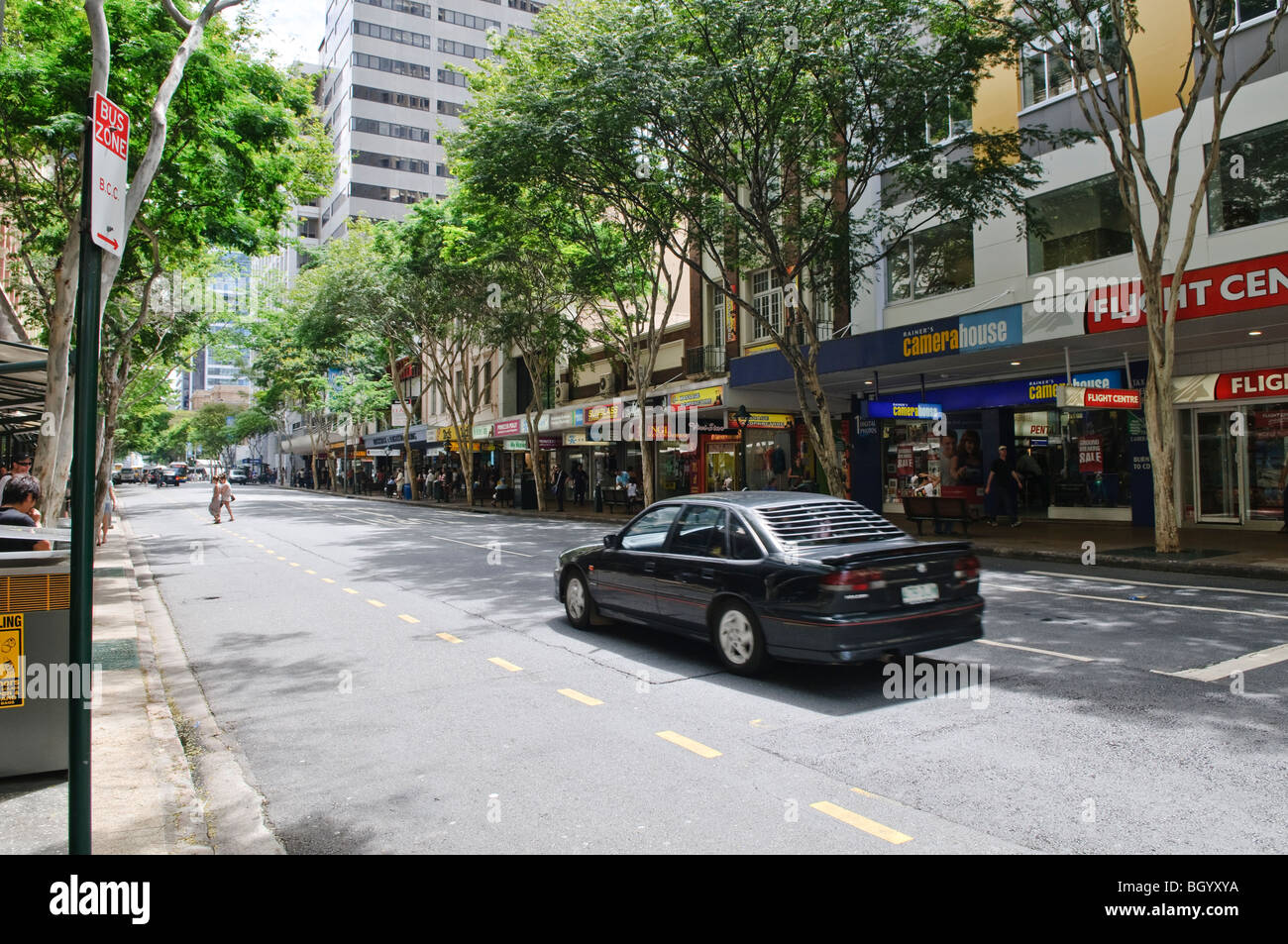 BRISBANE, Australia — Pedestrians walk past retail shops along Adelaide ...