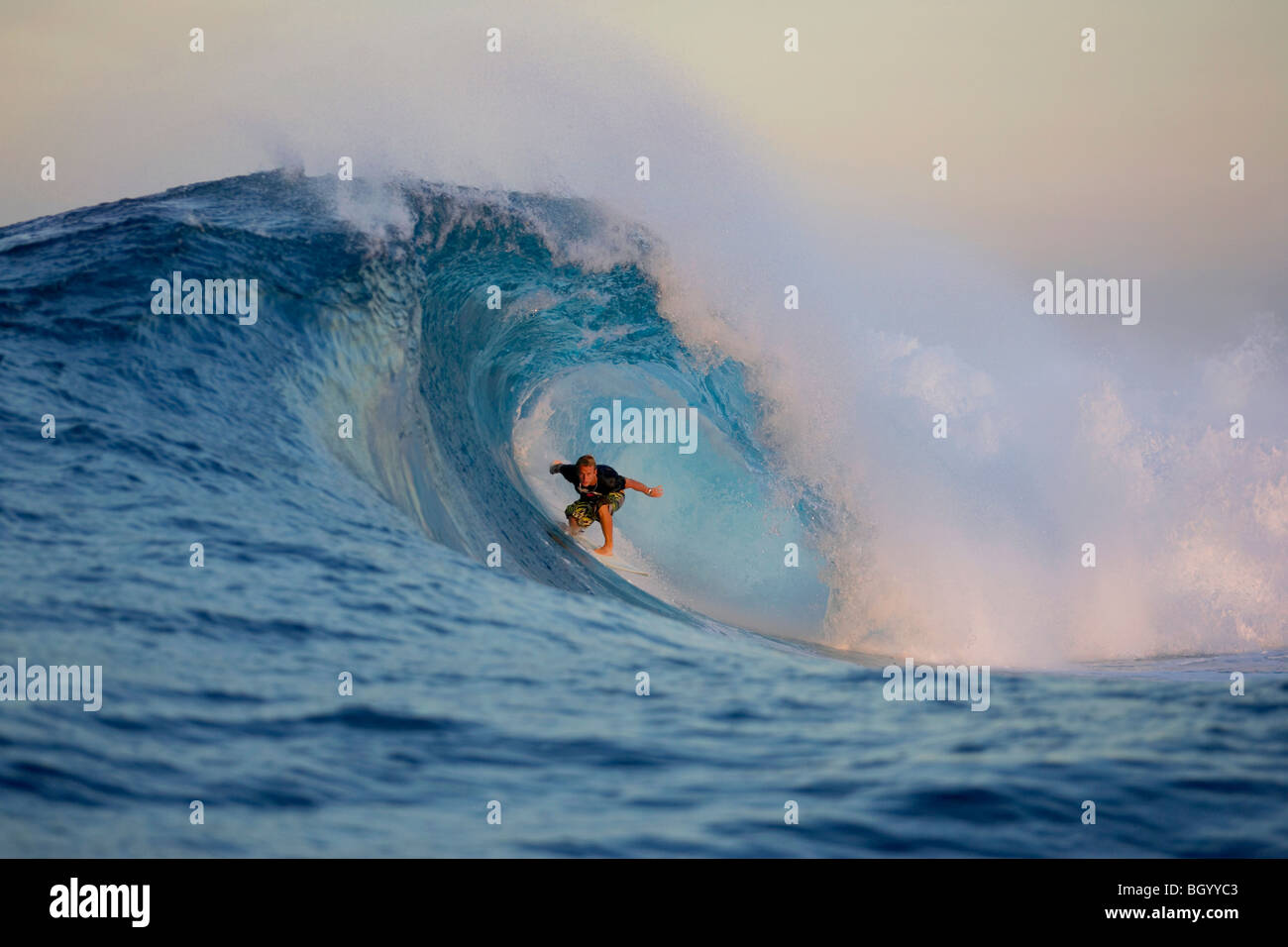 Surfer in the tube of large wave Stock Photo - Alamy