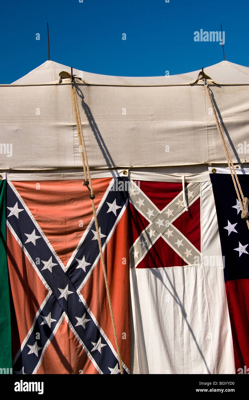 Civil war banners hagning in the bright sunshine on the side of a white ...