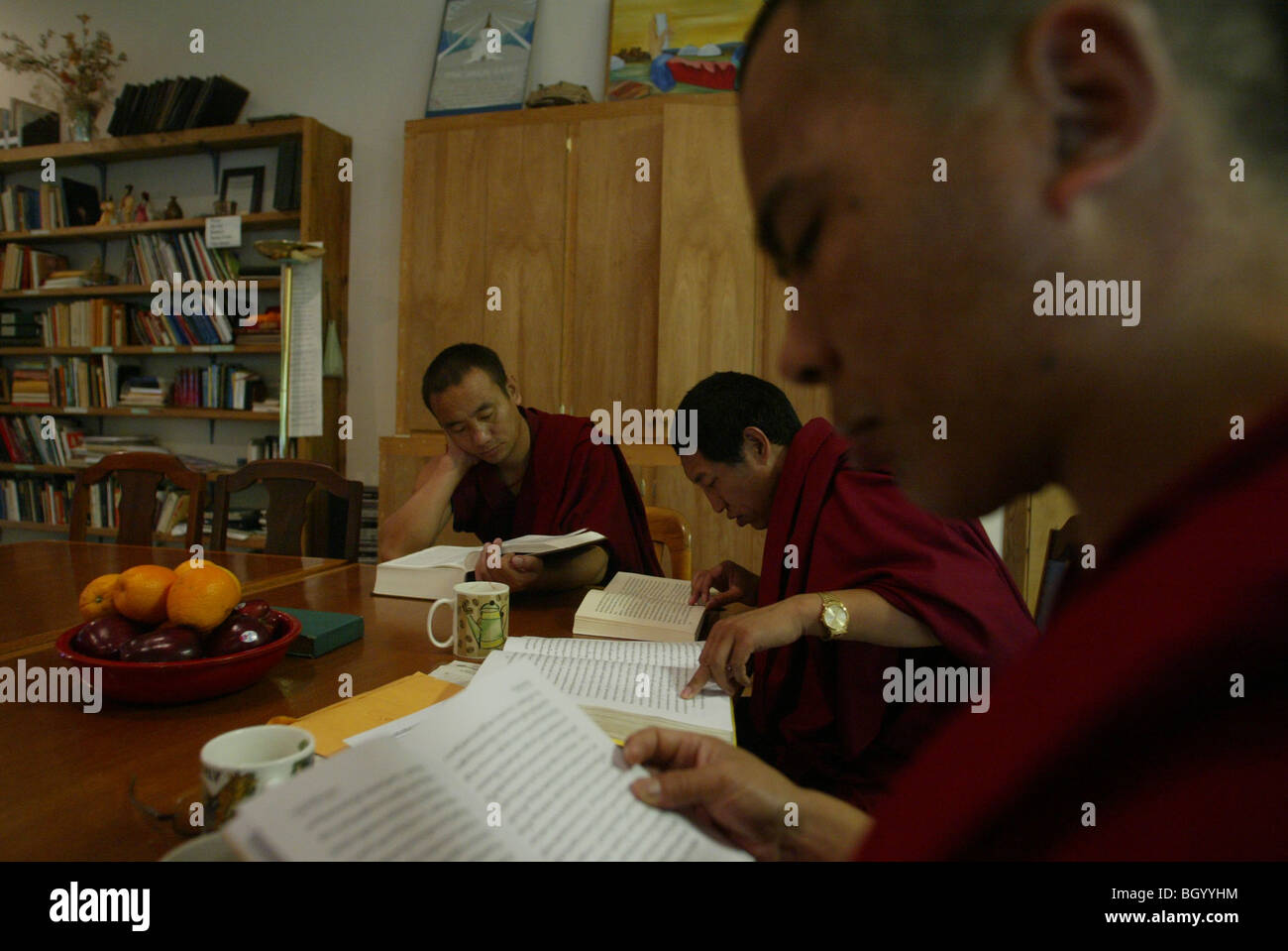 Tibetan Monks study while seated at the Tibetan Culture Center Stock ...