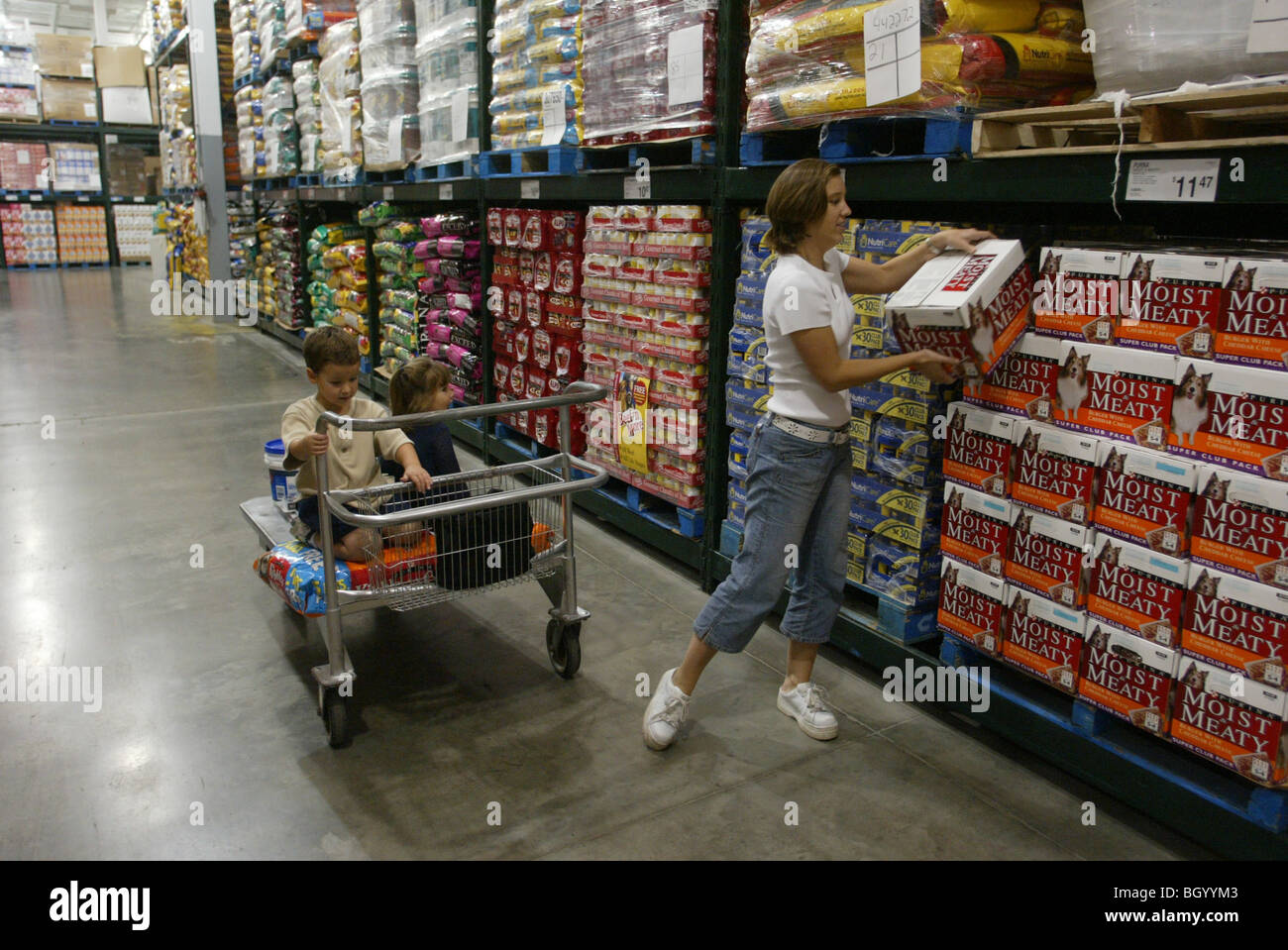Lourdes Heumann shops with her children Rachel and Ryan who are twins ...