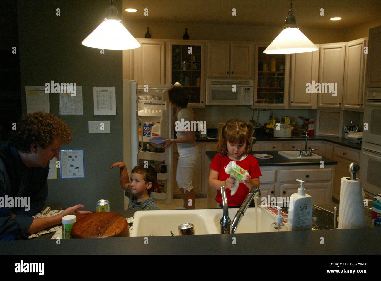 Cardiologist Greg Heumann gets a hi-five from his son Ryan Heumann ...