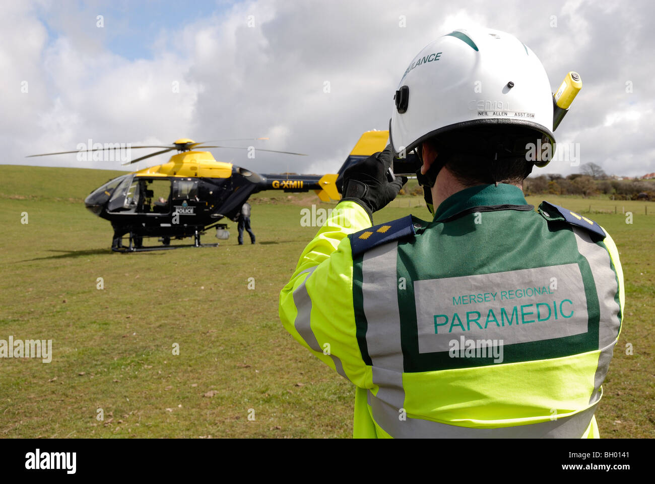 Paramedic watches Police Helicopter landing Stock Photo - Alamy
