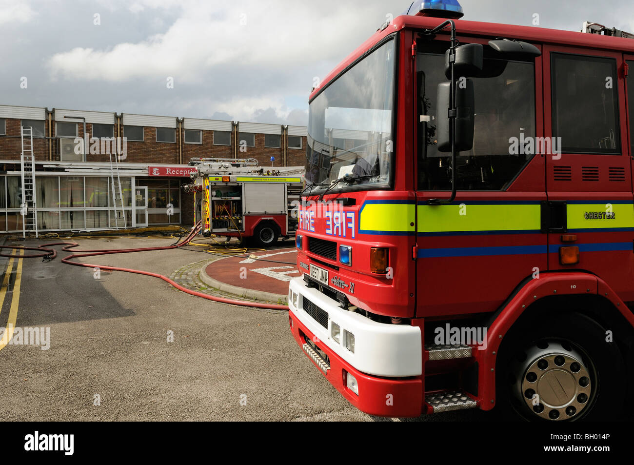 Fire engines at school on fire Stock Photo - Alamy