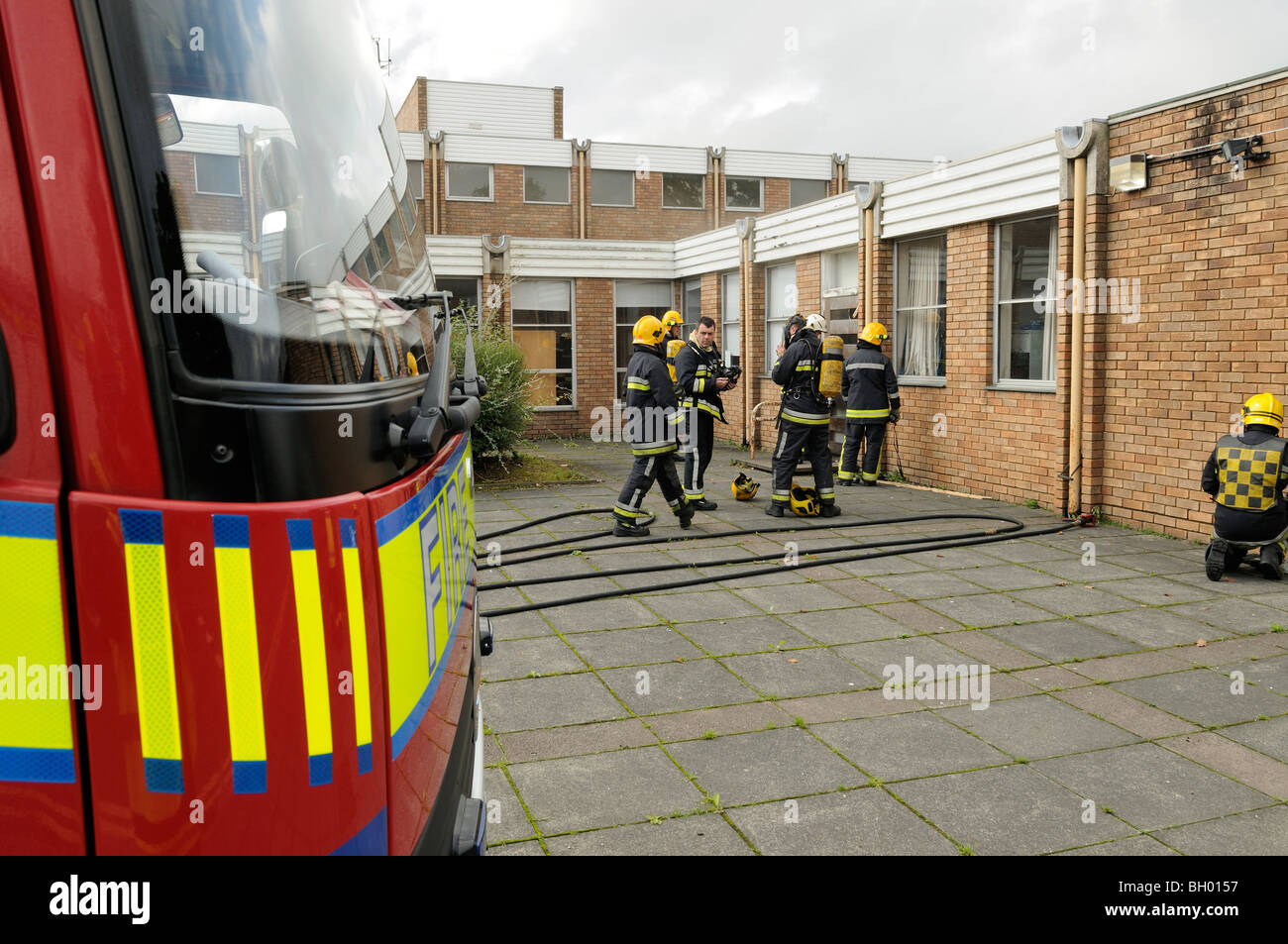 Firemen enter school classroom on fire Stock Photo - Alamy