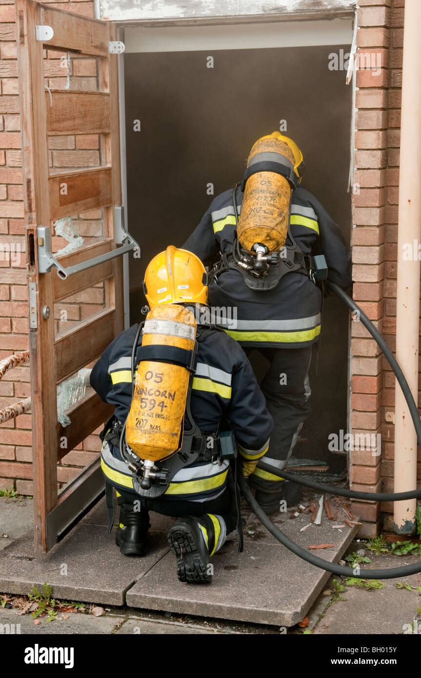 Firemen enter school classroom on fire Stock Photo - Alamy