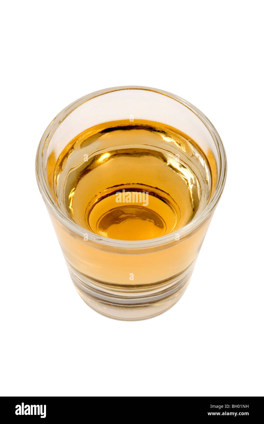 Whiskey neat in shot glass on white background Stock Photo - Alamy