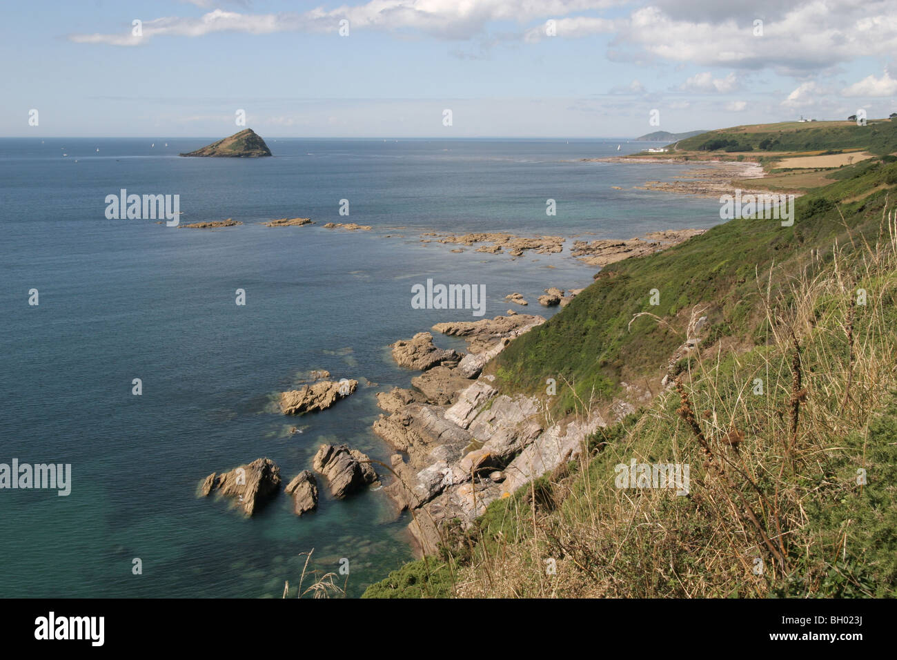 A view of the coast at Wembury, Devon UK, with the Great Mewstone ...