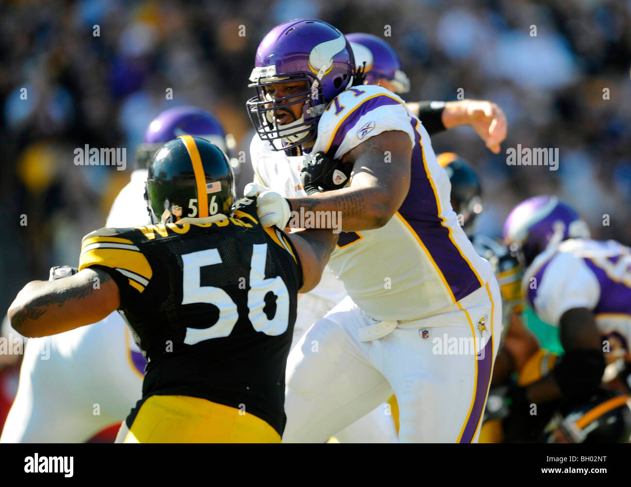 Phil Loadholt #71 of the Minnesota Vikings blocks against LaMarr ...
