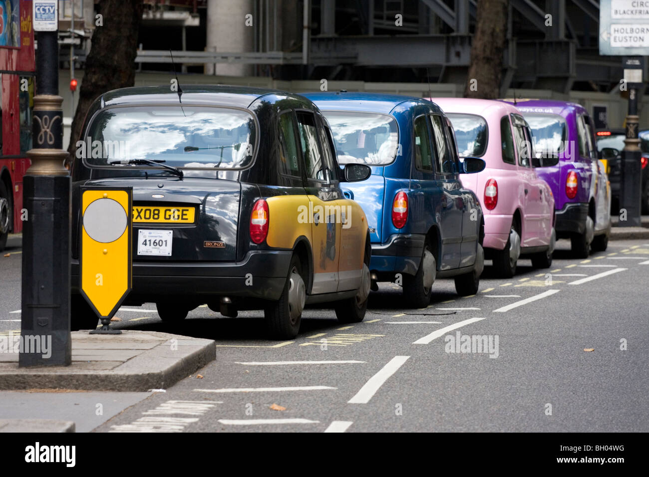 Multi coloured colored London Taxis parked in the Aldwych Stock Photo ...