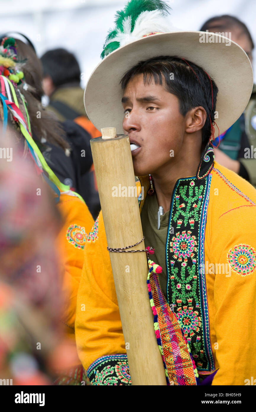 Man playing wind instrument in andean ceremony in evo morales second ...