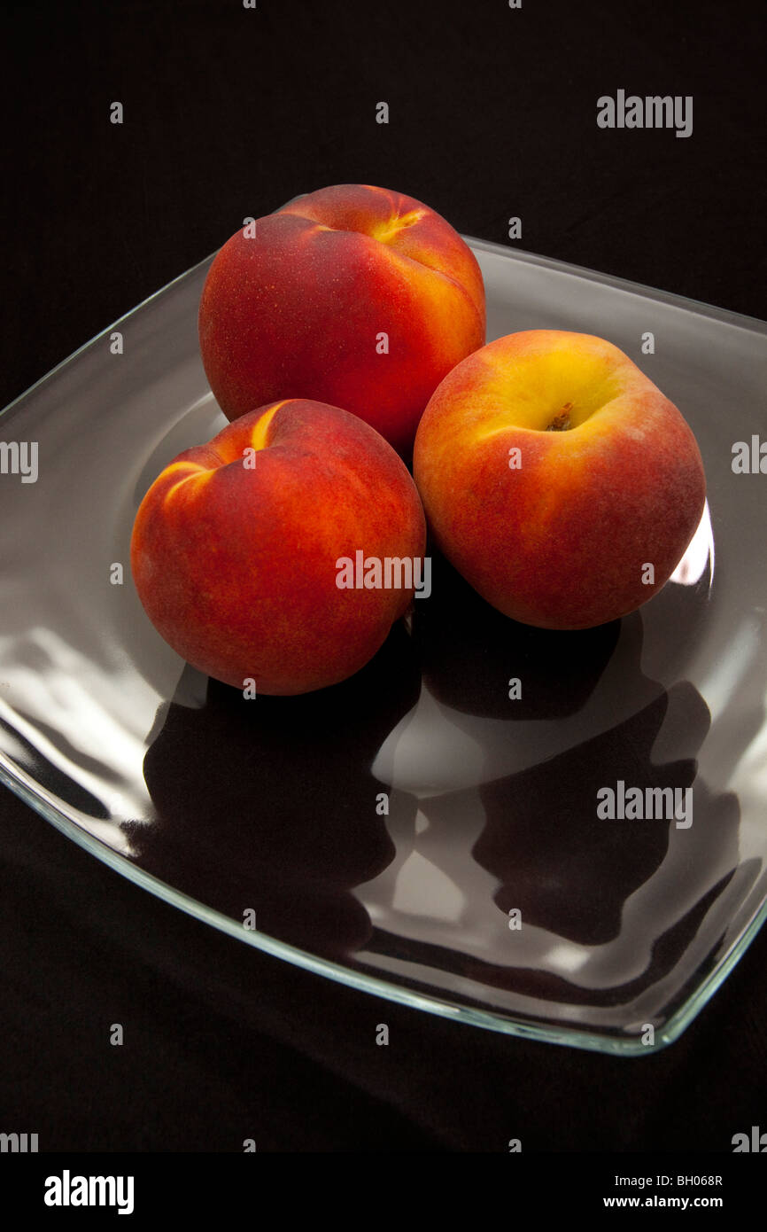 Three ripe peaches Stock Photo - Alamy