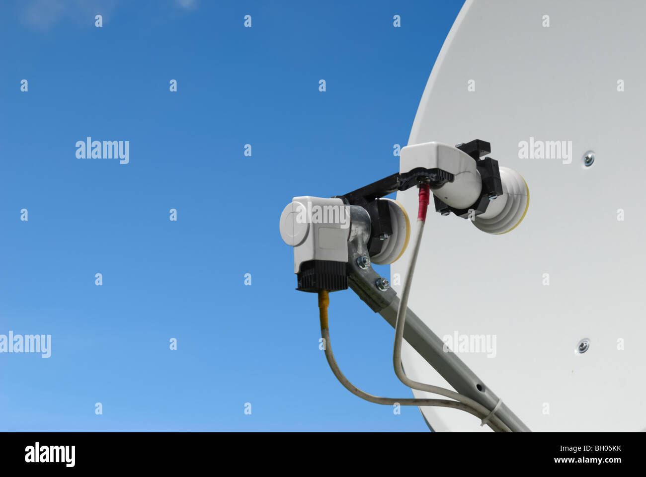 Satellite dish on the blue sky background Stock Photo - Alamy