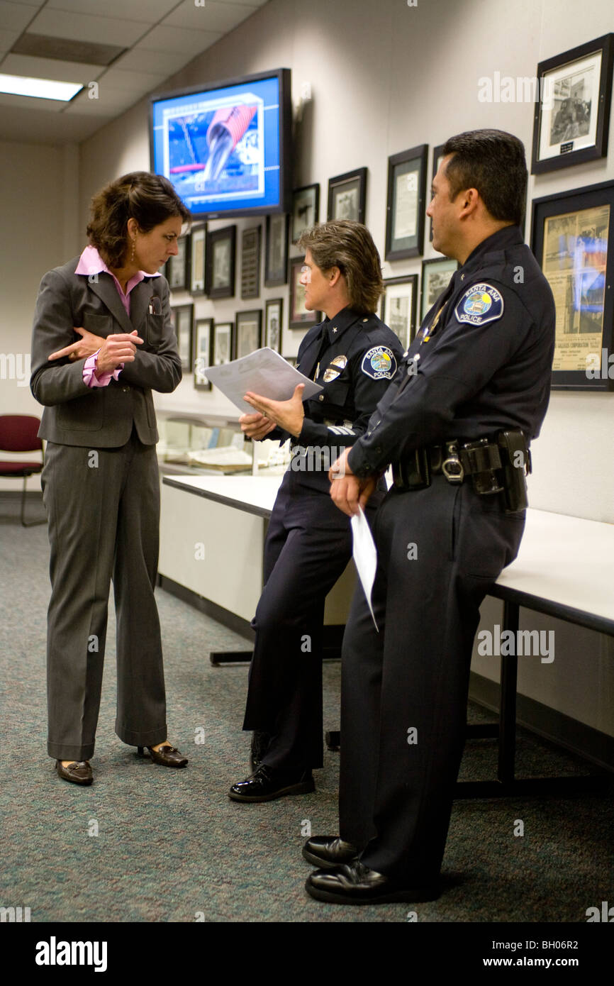 Female police officer talking to man hi-res stock photography and ...