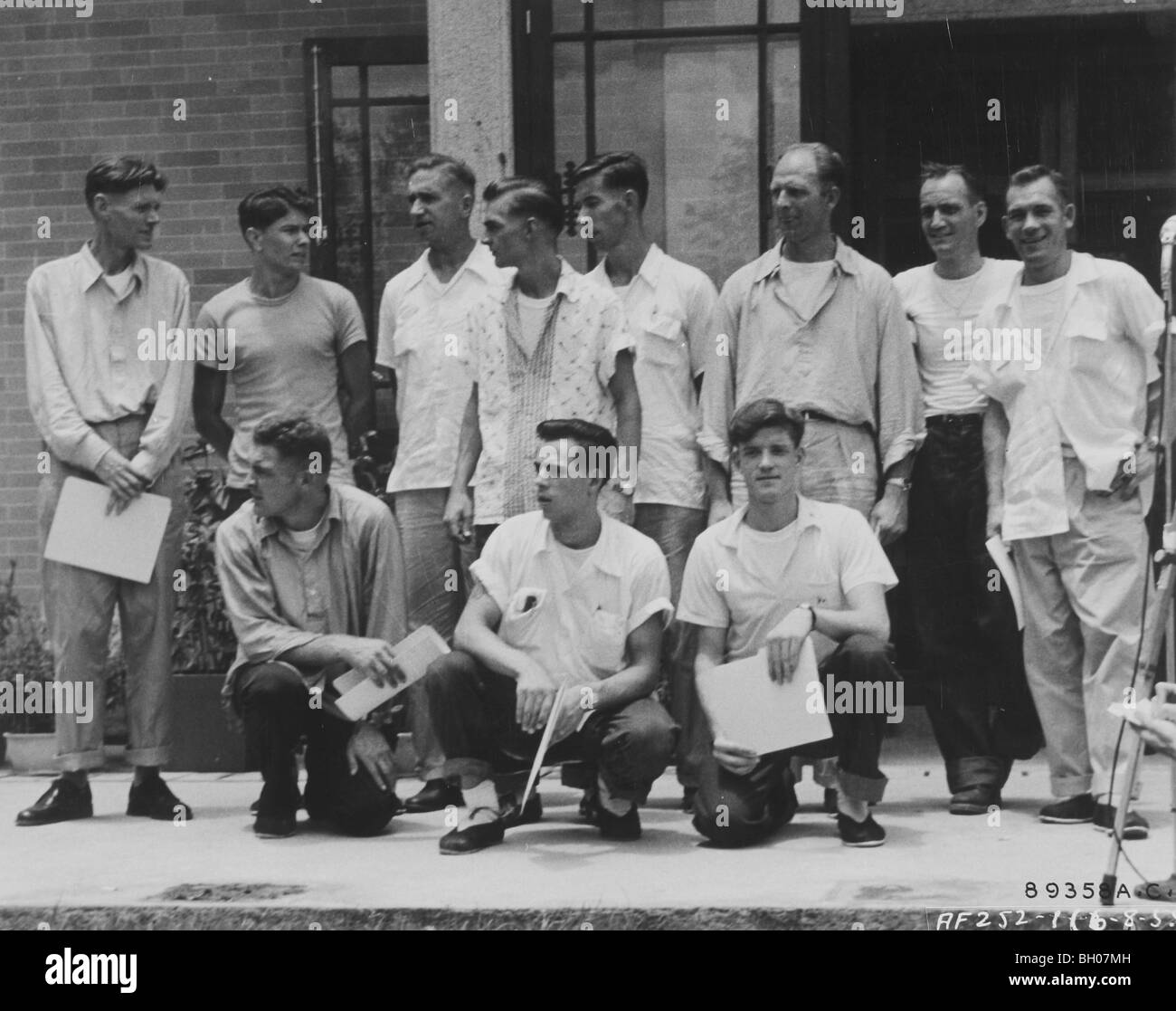 HQ. FEAF, Tokyo --- Shown after their return to freedom in Hongkong are ...