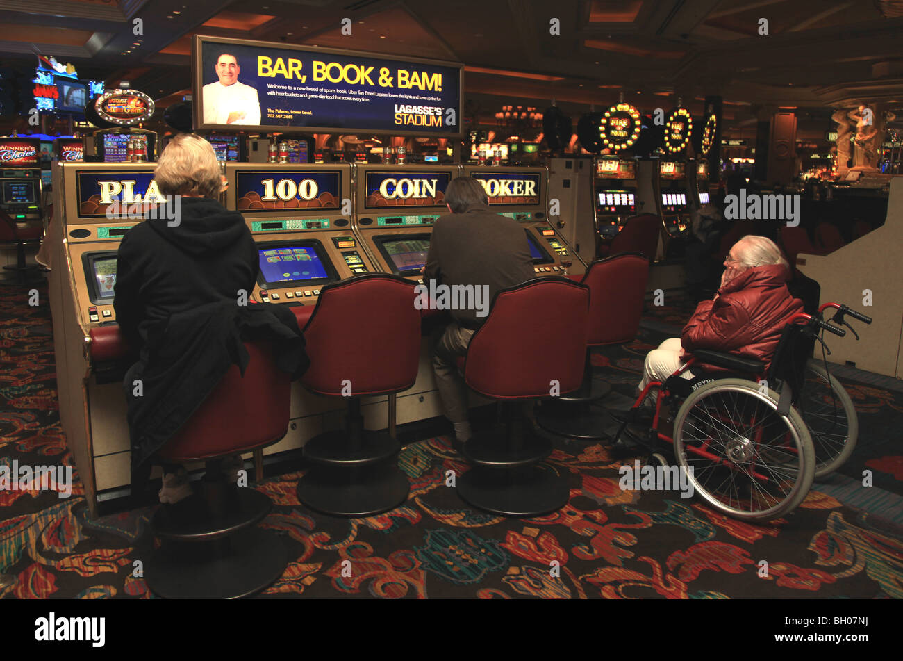 Man and woman playing gaming machine hi-res stock photography and ...