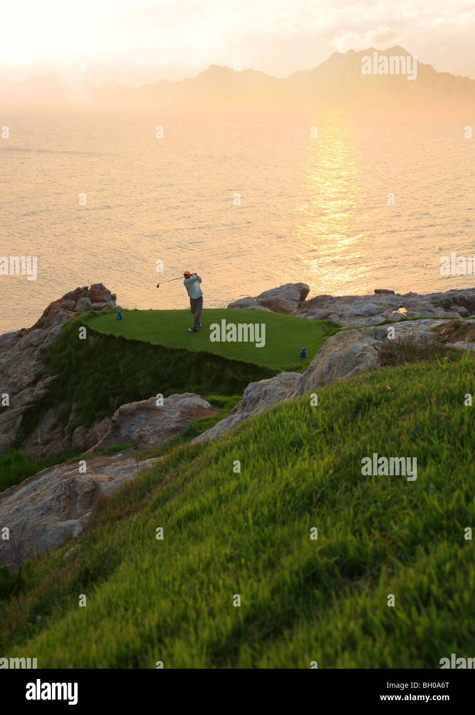 Man playing golf in golf course Stock Photo - Alamy