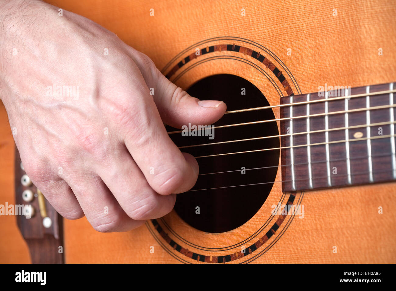 closeup of hands of a musician playing acoustic guitar Stock Photo - Alamy