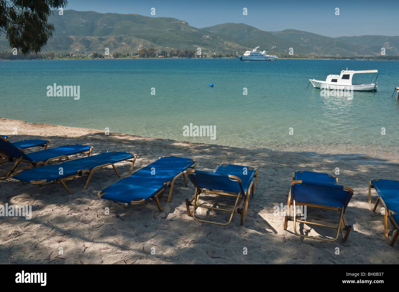 Empty sun loungers on Megalo Neorio beach, Poros Island, Greece Stock ...