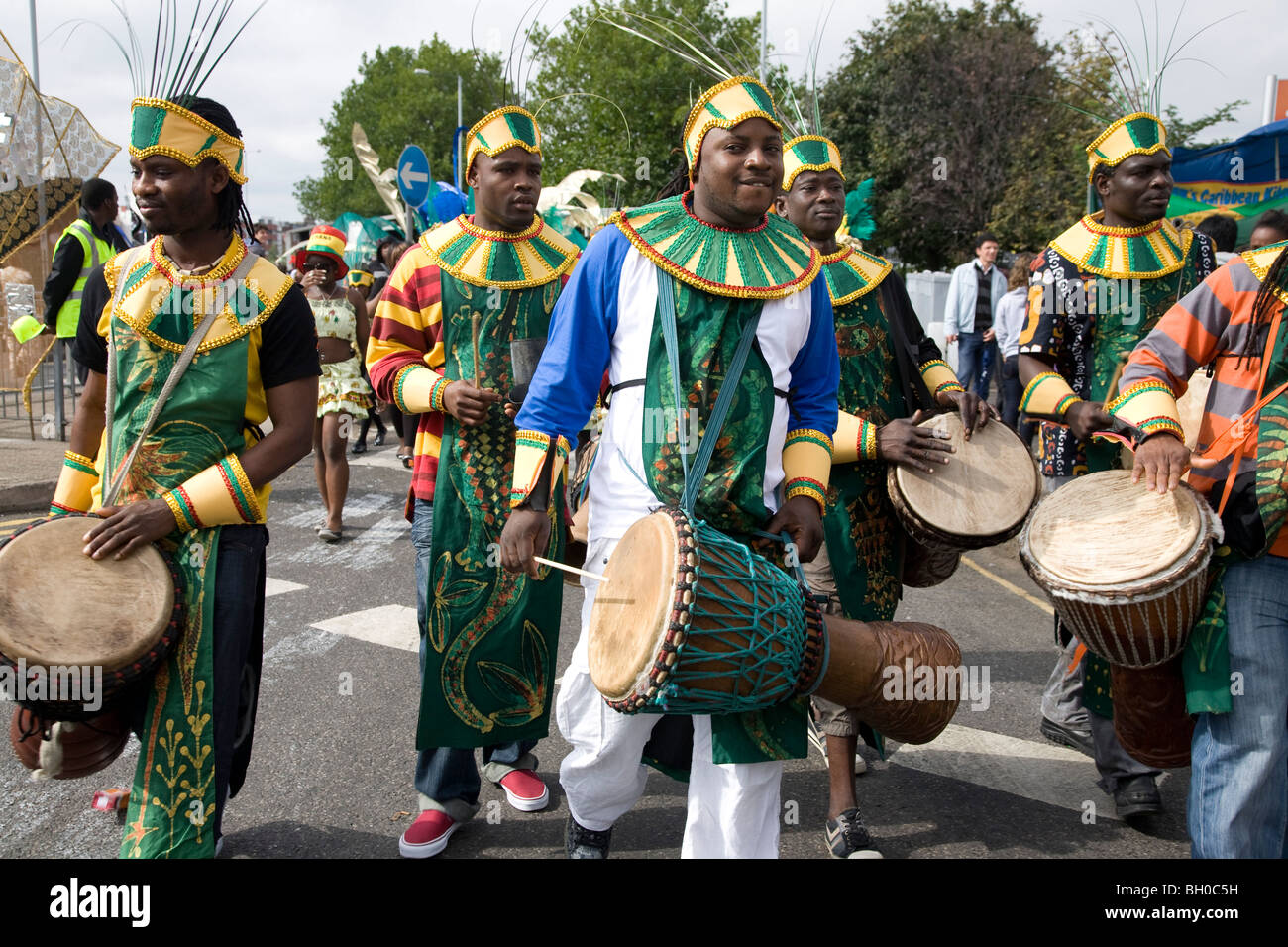 Young men in carnival costume. Band of drummers. Notting Hill Carnival ...