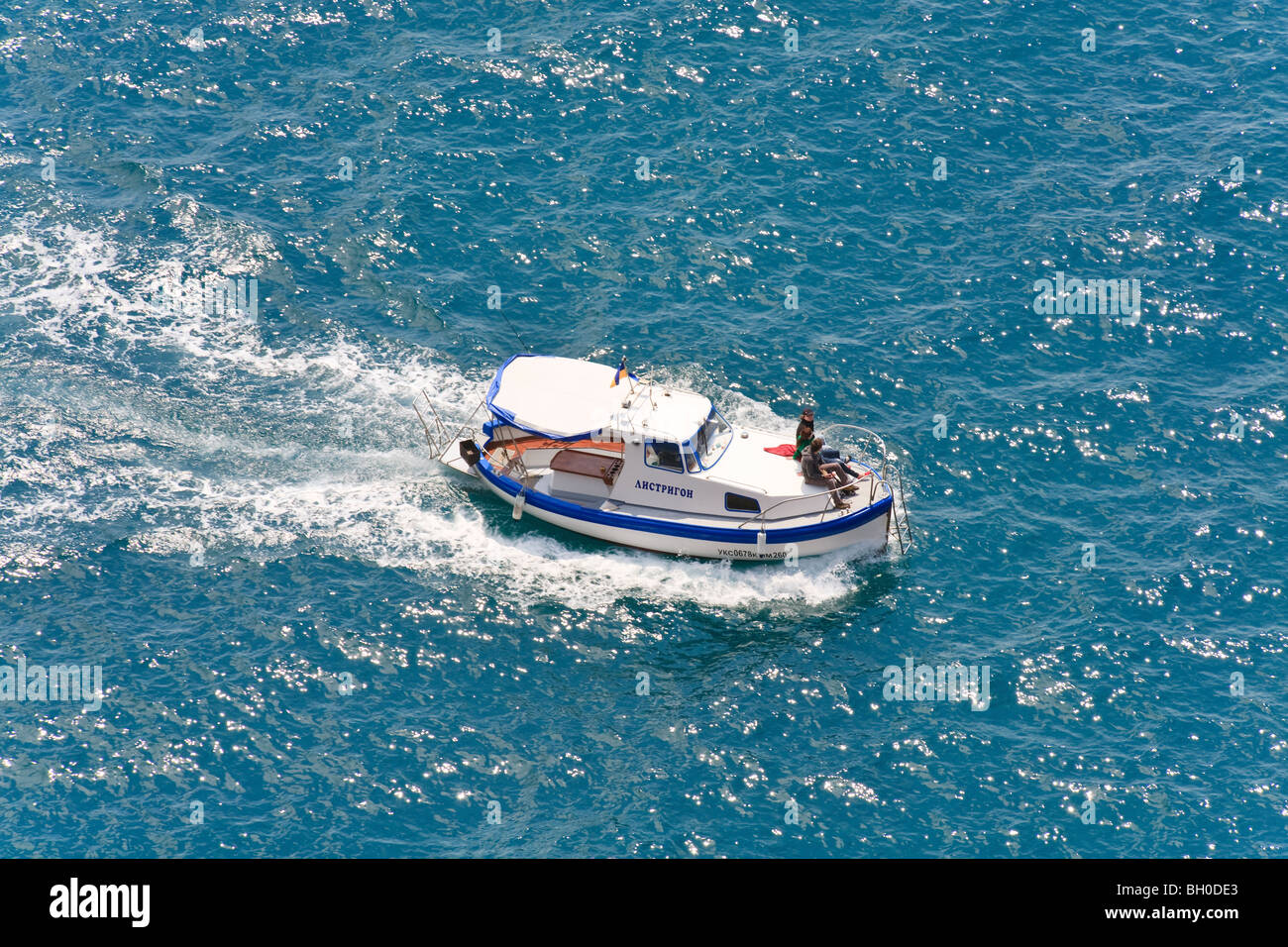 White motorboat on sea surface Stock Photo - Alamy