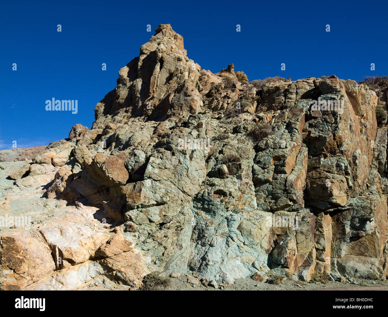 Volcanic rock formation stained blue by iron and copper salts by ...