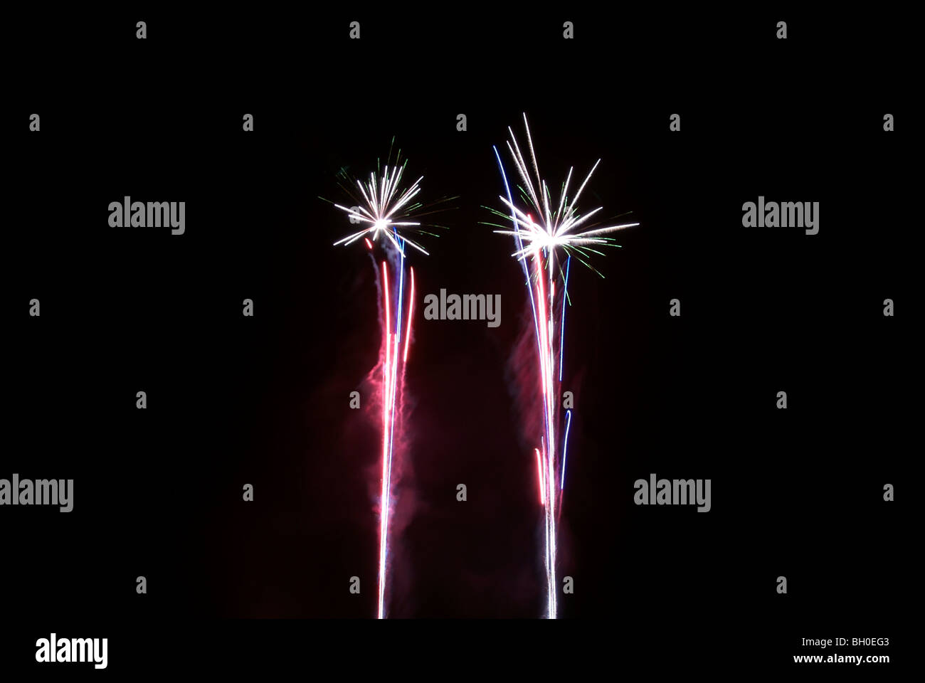 Two fireworks bursting together Stock Photo - Alamy