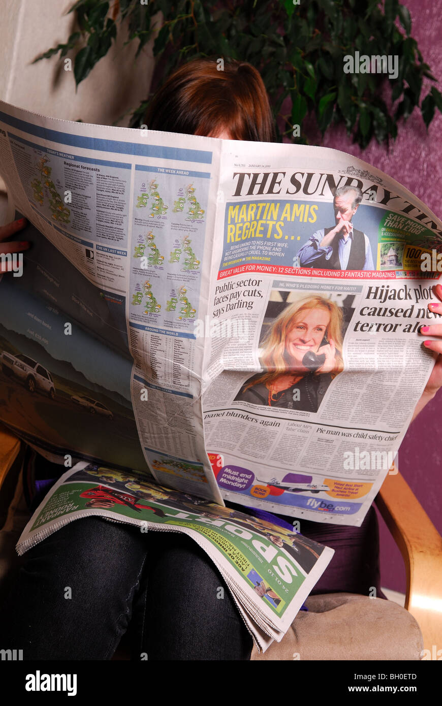 Teenager Reading Sunday Newspaper Stock Photo - Alamy