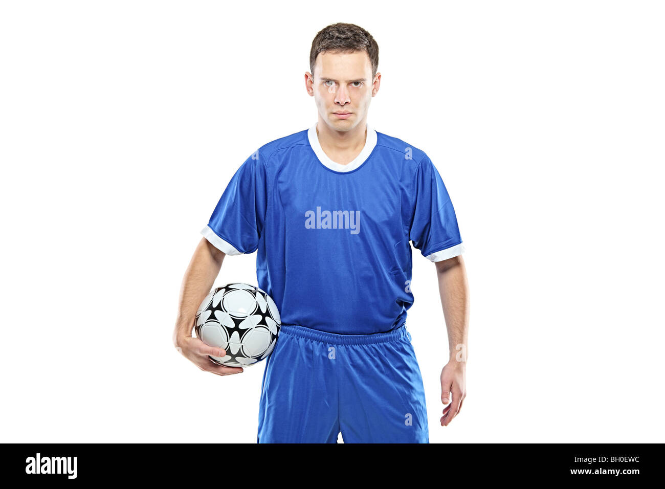 Angry soccer player holding a ball isolated on white background Stock ...
