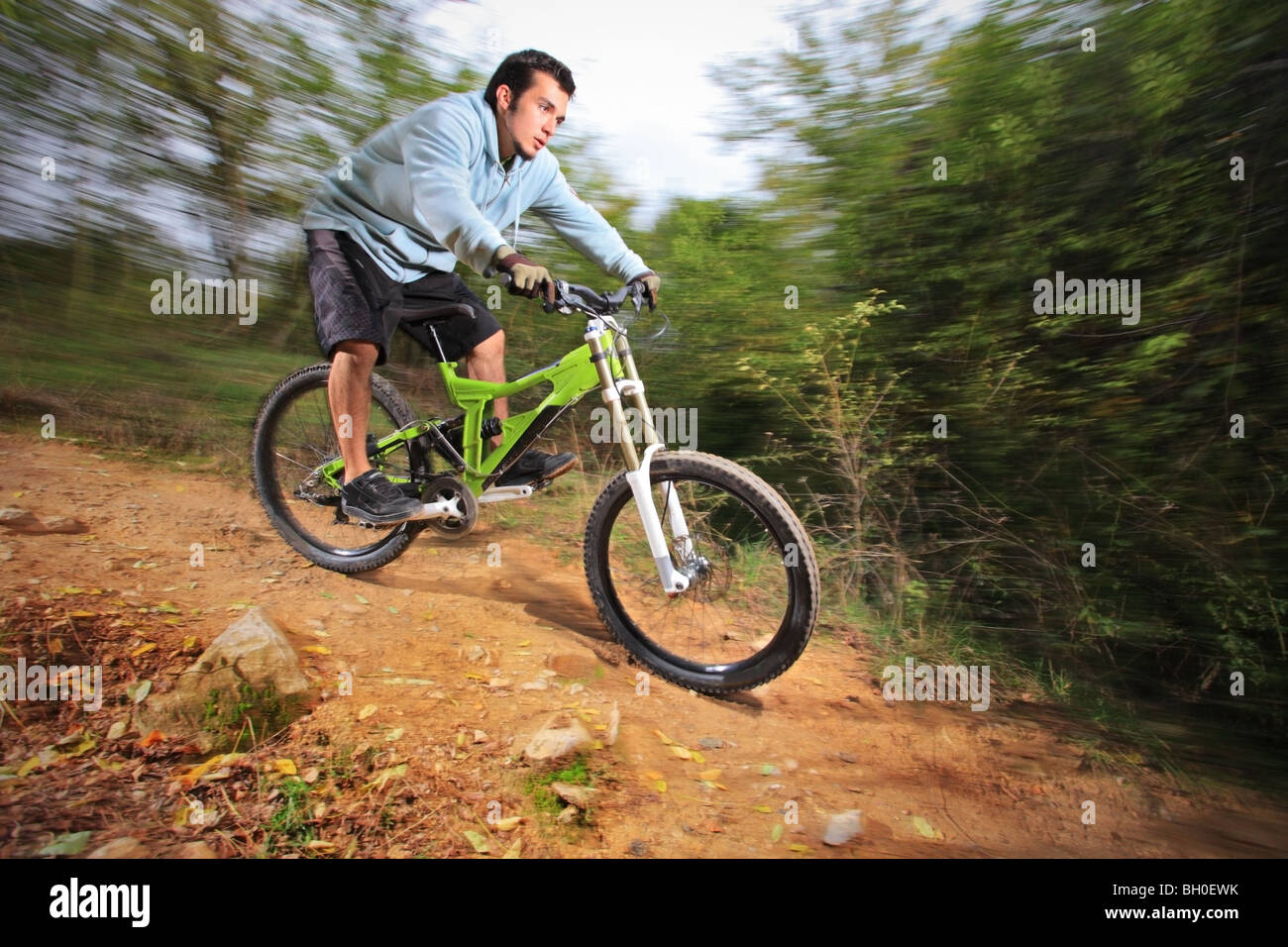 Person riding a mountain bike down the hill Stock Photo - Alamy