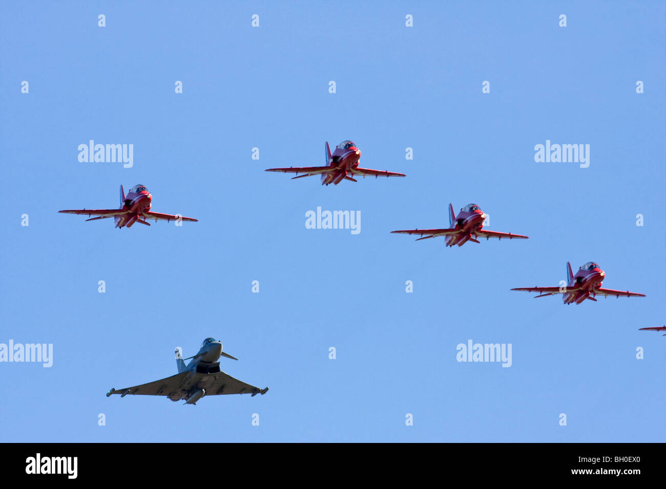The Red Arrows and Eurofighter Typhoon in formation approach at RAF ...