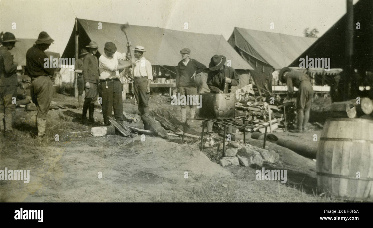 Chopping wood and cooking in mess area. United States Cavalrymen along ...