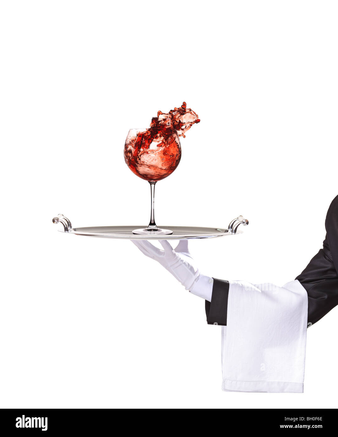 Butler holding a tray with a wine glass on it, isolated on white Stock ...