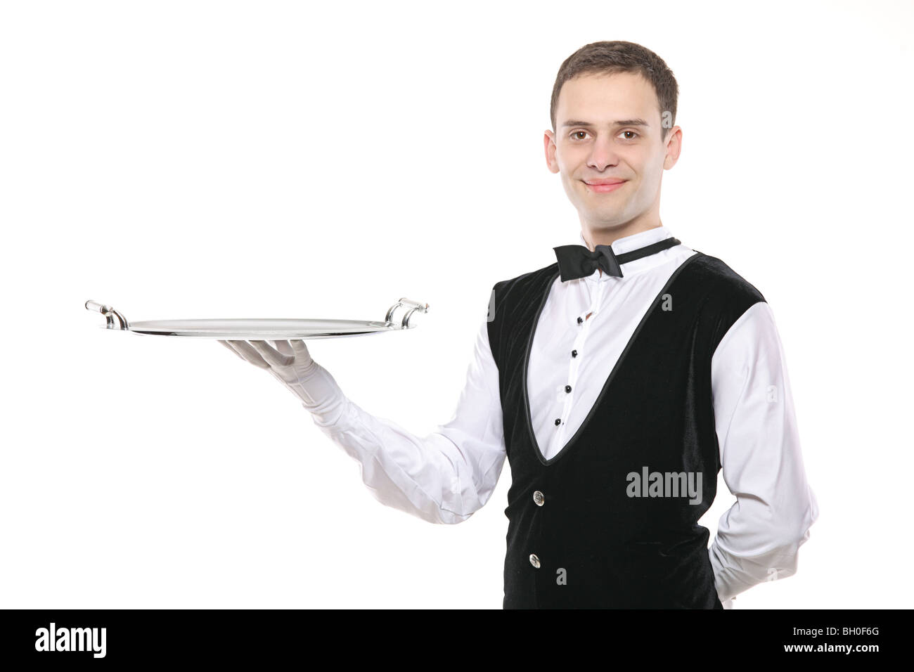 Butler holding an empty tray isolated on white Stock Photo - Alamy