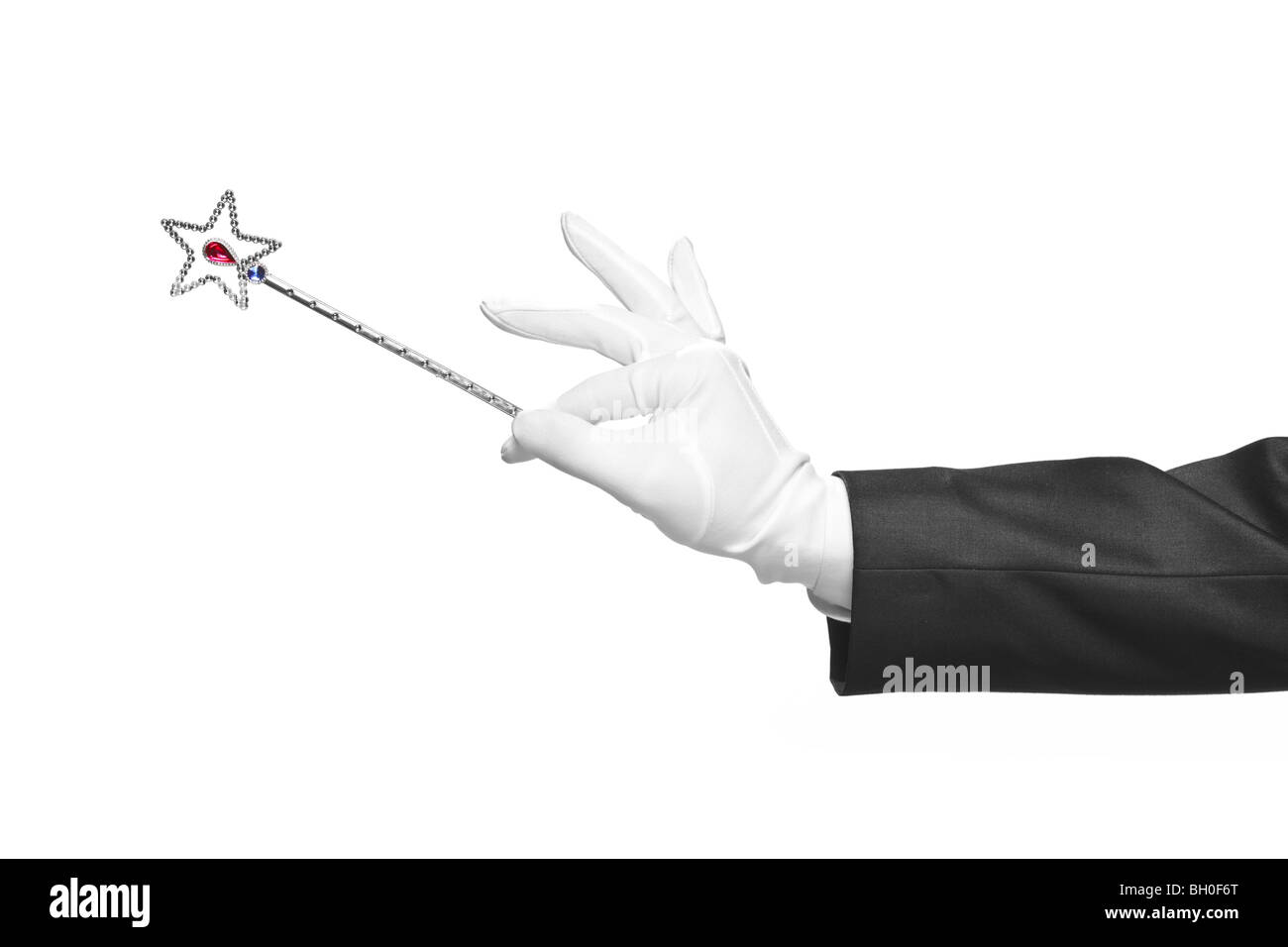 Hand holding a magic wand, isolated on white background Stock Photo - Alamy